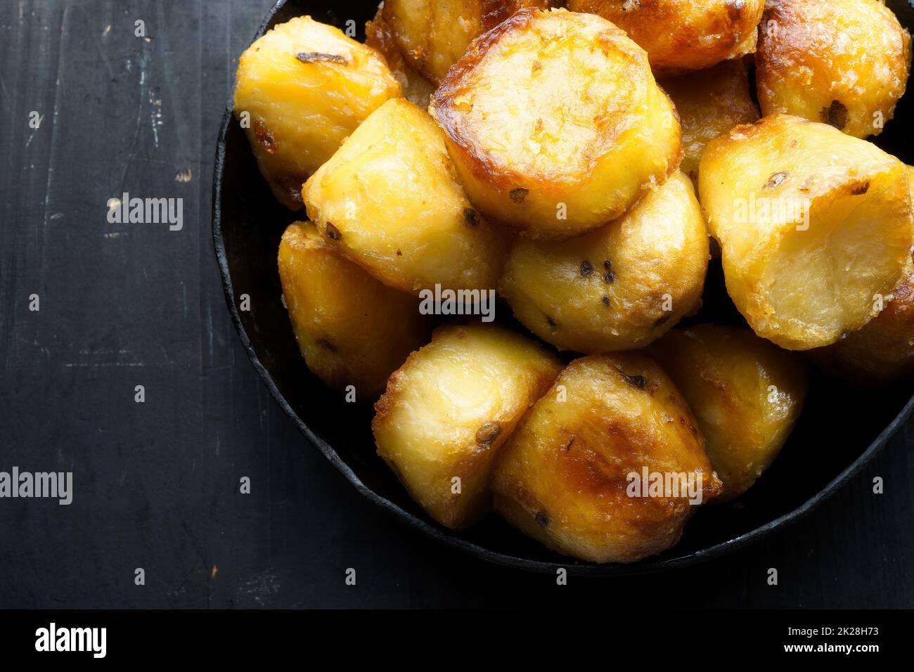 rustic golden english roasted duck fat potatoes Stock Photo - Alamy