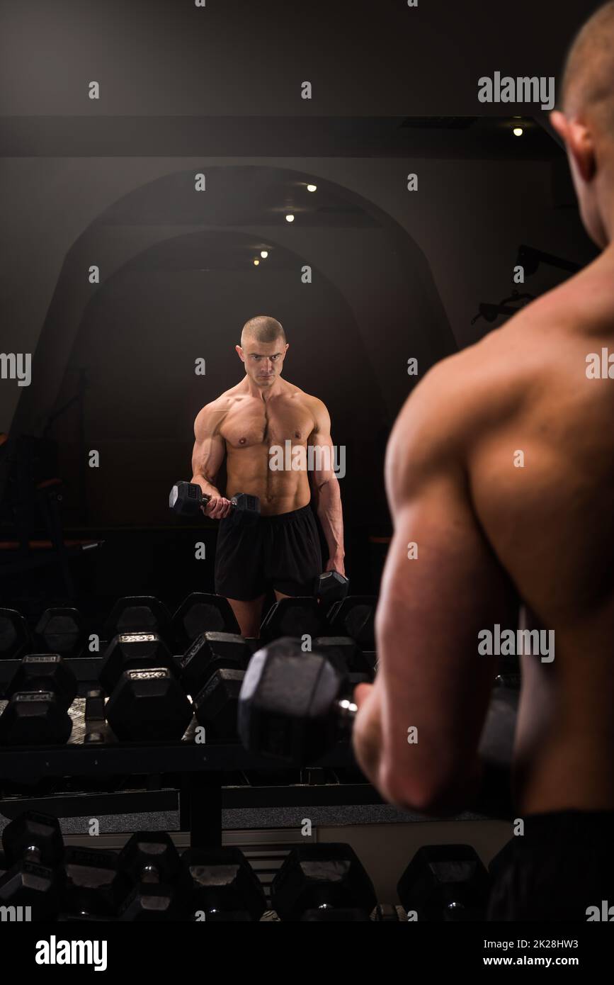 Bodybuilder in a mirror Stock Photo - Alamy