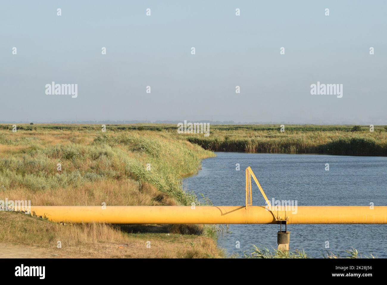 The gas pipeline through the small river Stock Photo - Alamy
