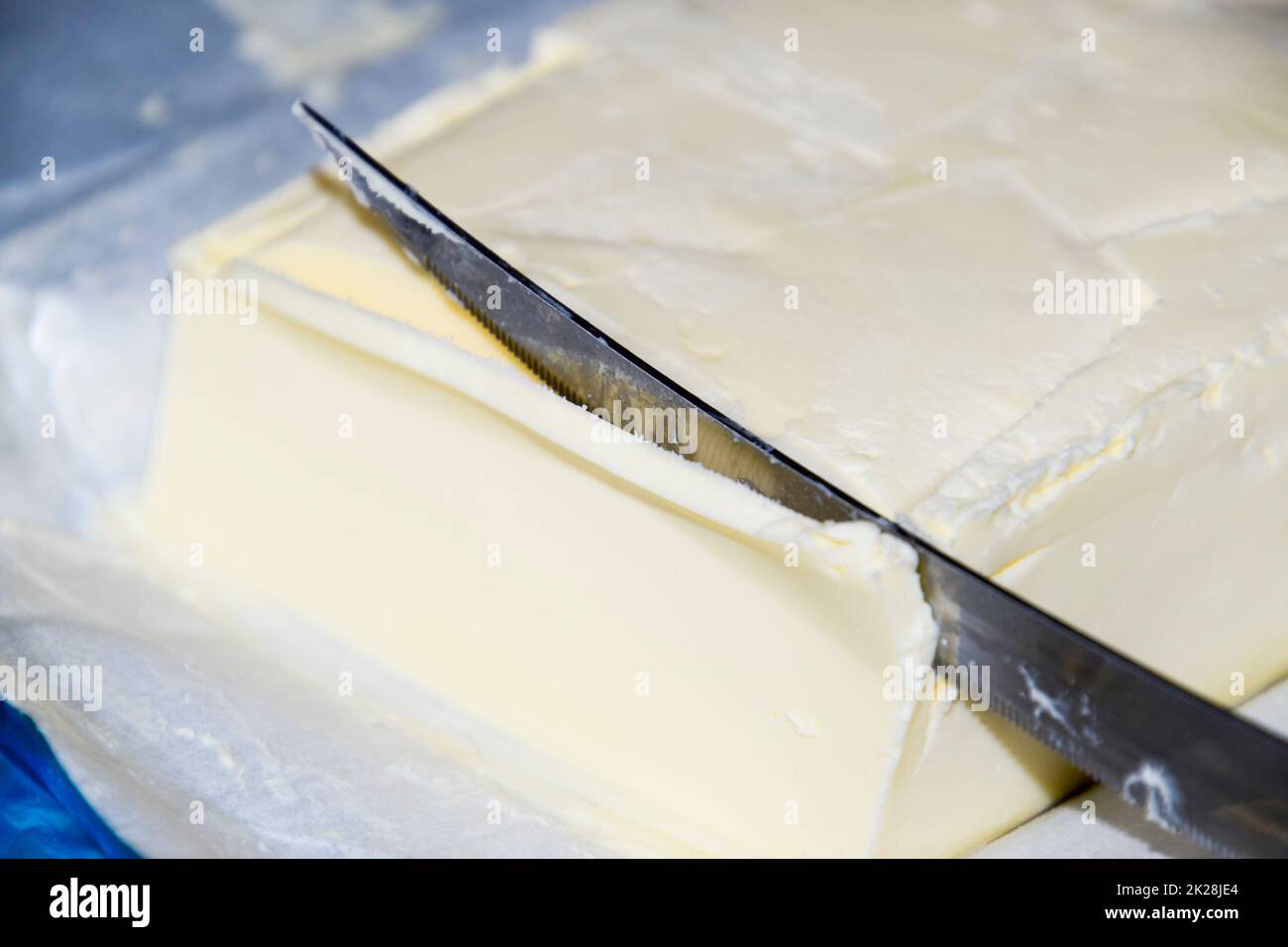 Cutting a butter knife. Butter and knife Stock Photo - Alamy