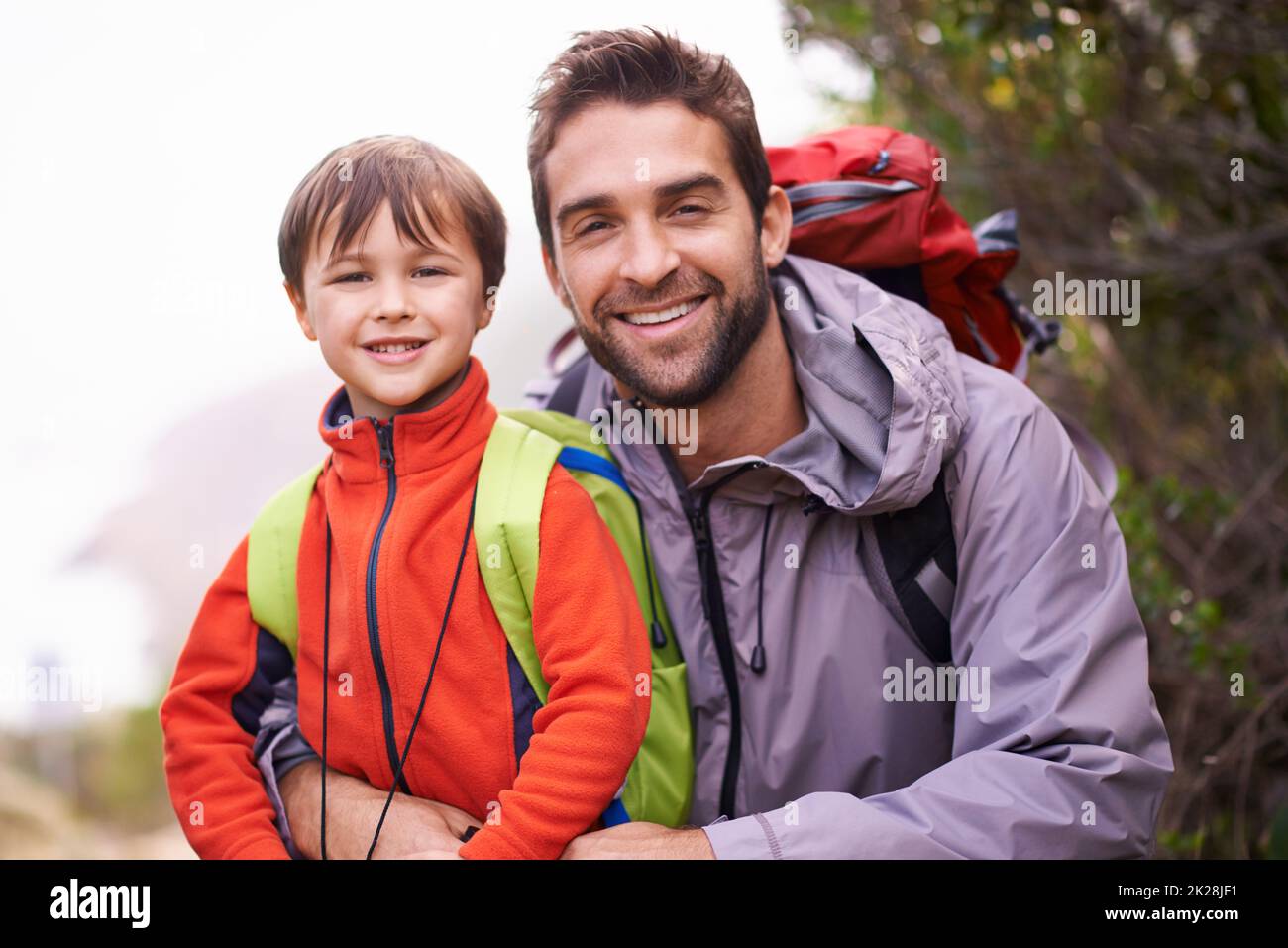 Hes already an avid little hiker. Portrait of a father and son enjoying ...
