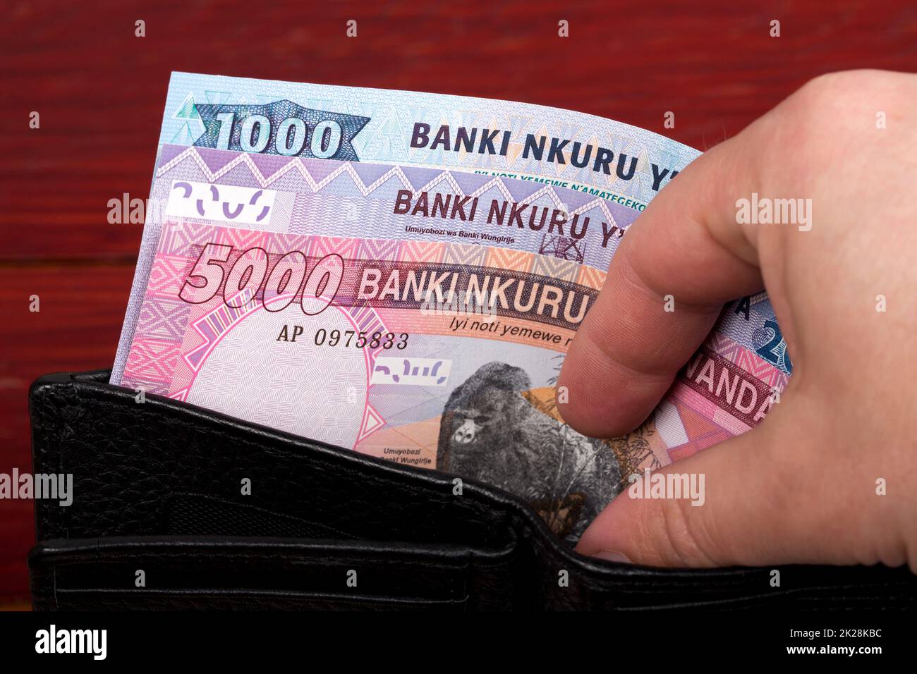 Rwandan money in the black wallet Stock Photo - Alamy