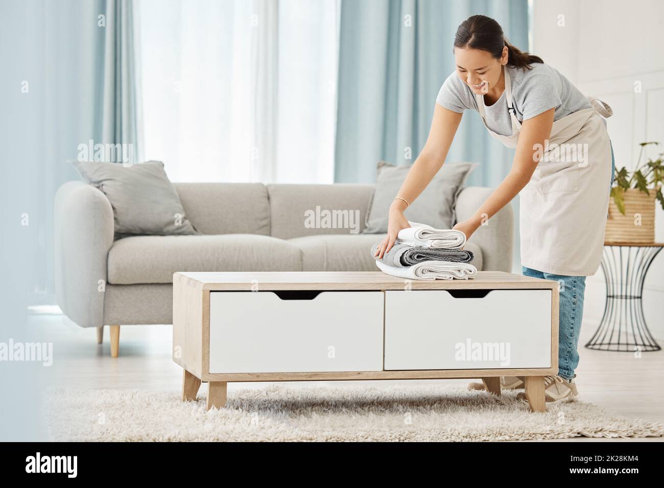 Asian cleaner or woman with towel laundry happy working for luxury ...