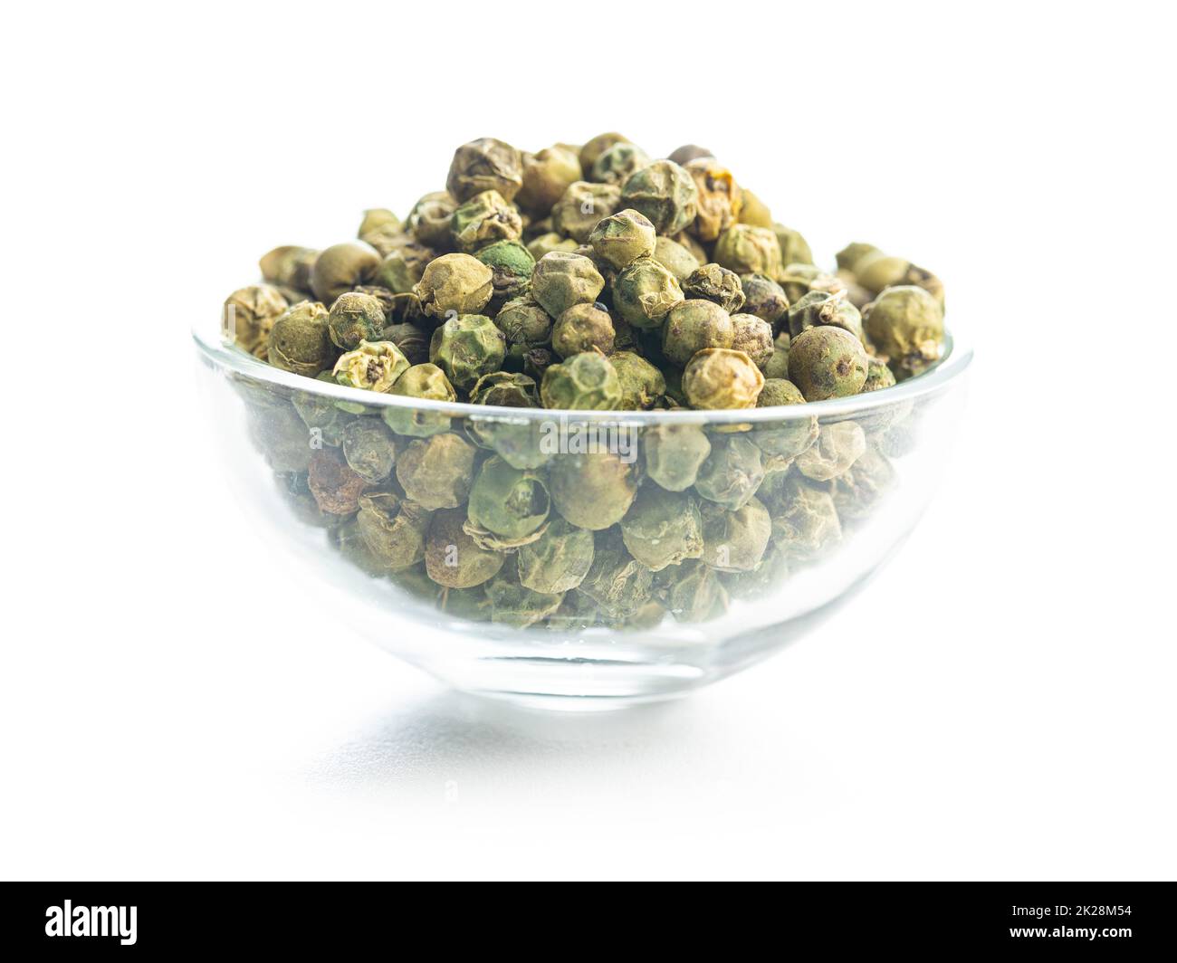 Dried green peppercorn. Dry green pepper spice in bowl isolated on ...