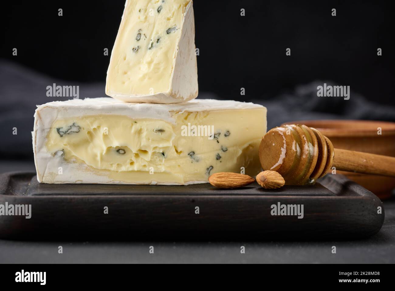 bergader blue cheese on a black wooden board, delicious snack Stock ...