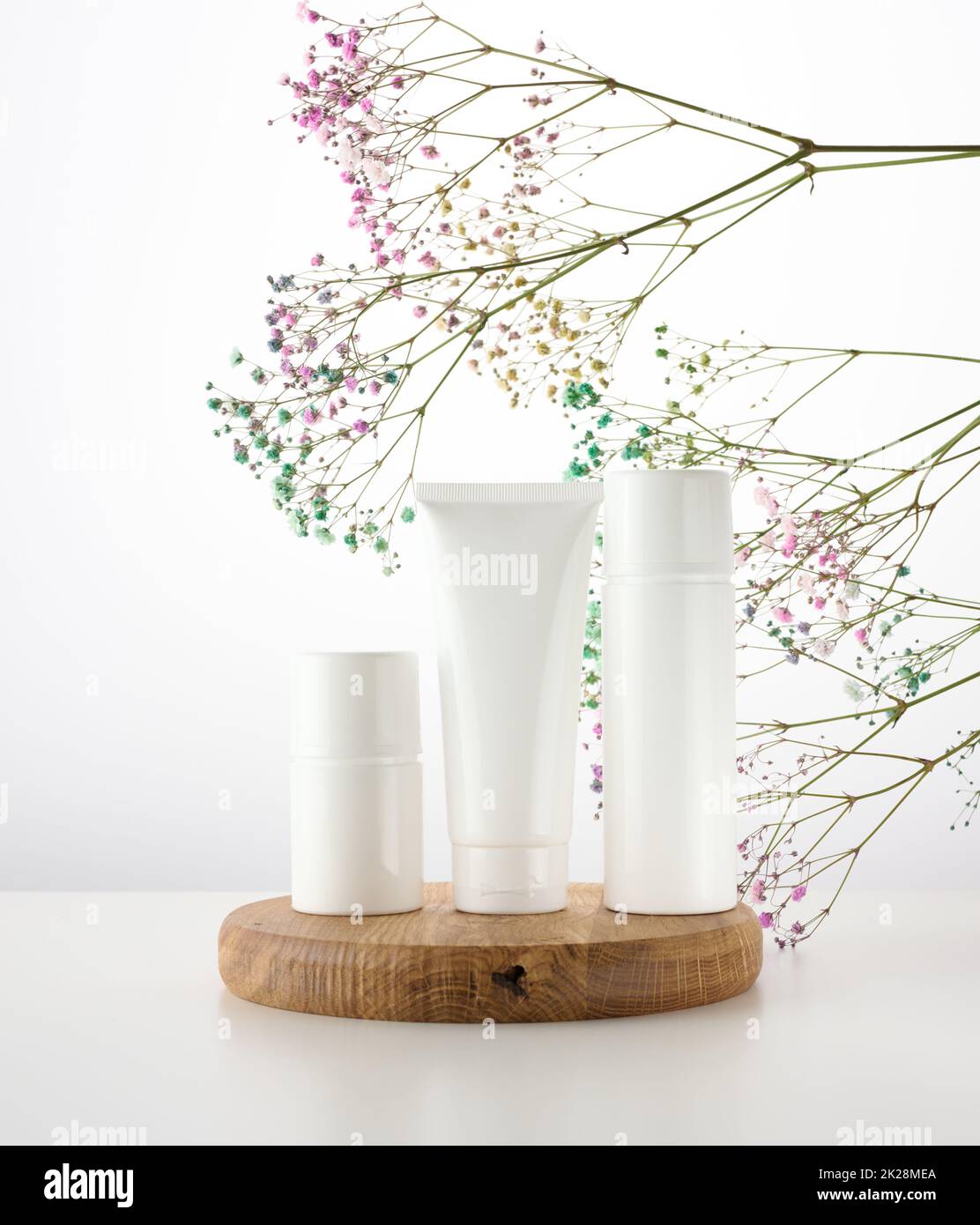 bottle, empty white plastic tubes for cosmetics. Packaging for cream ...