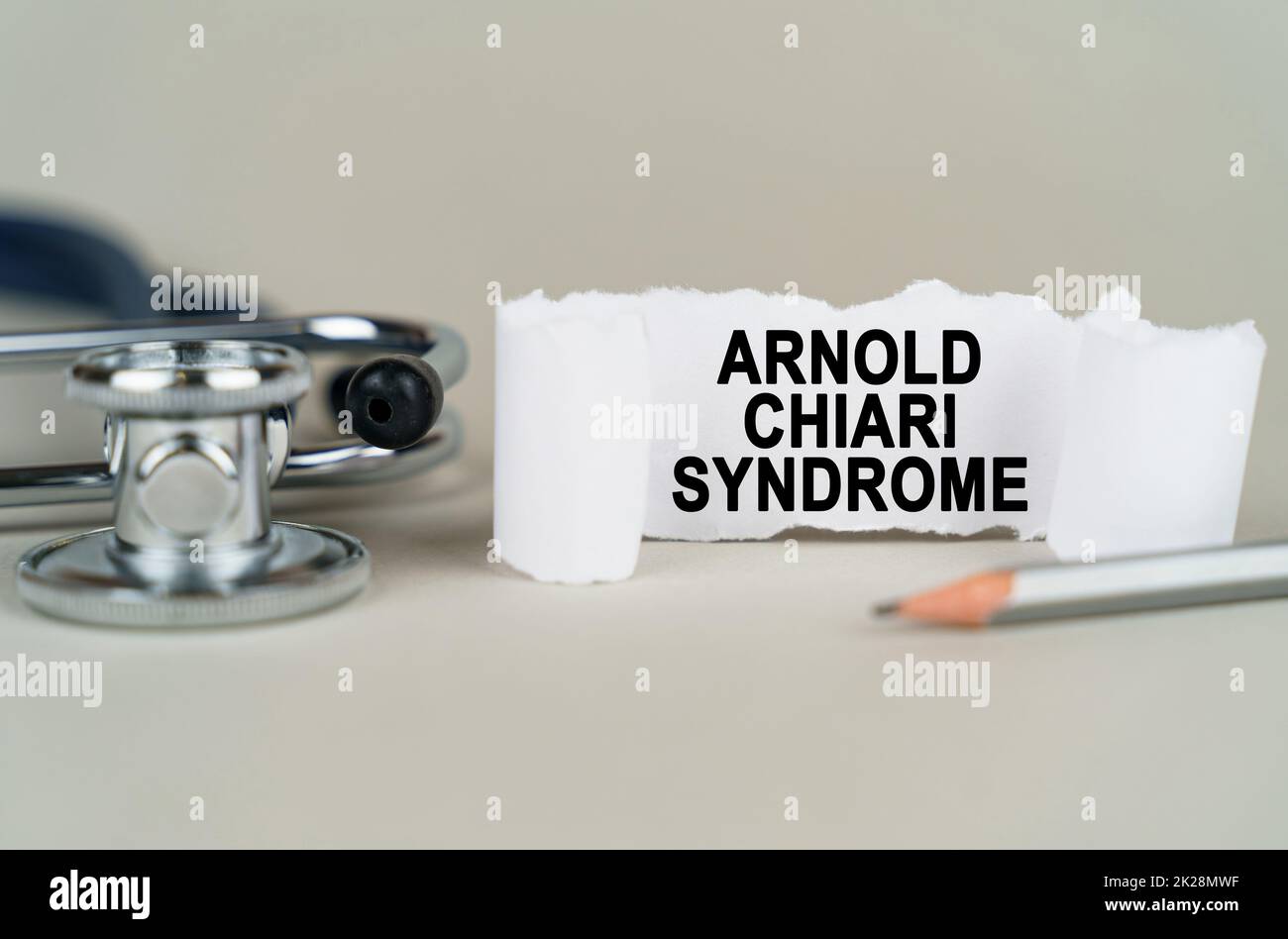 Medical concept. On a gray background, a stethoscope, a pencil and a ...