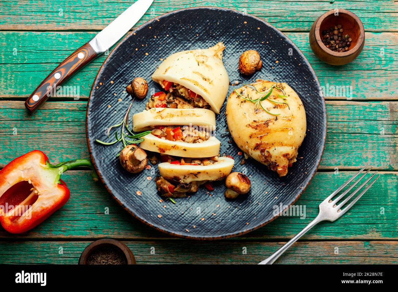 Tasty roast squid with vegetable stuffing Stock Photo - Alamy