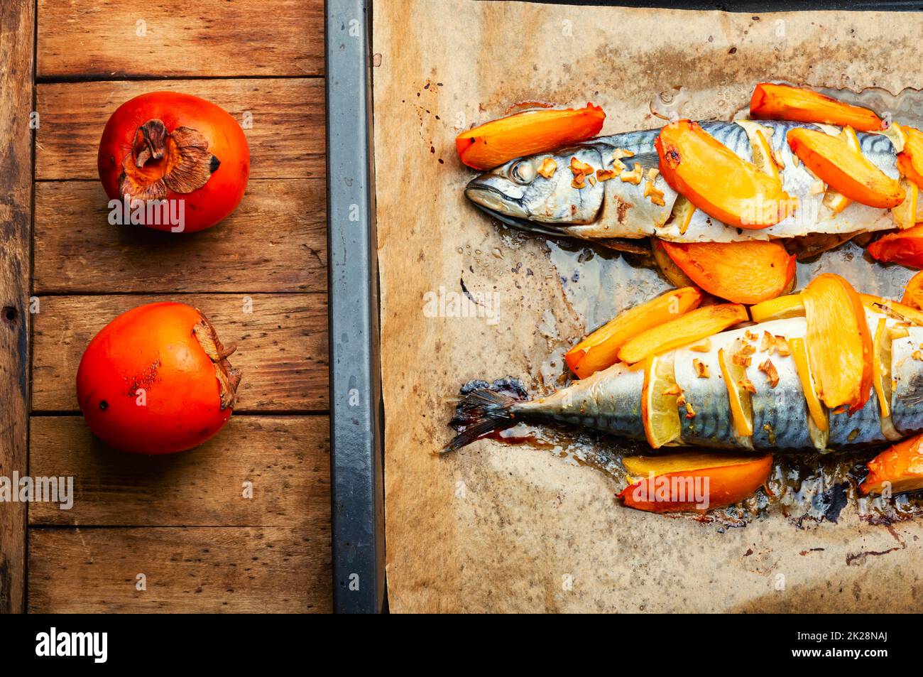 Baked scomber with persimmon Stock Photo - Alamy