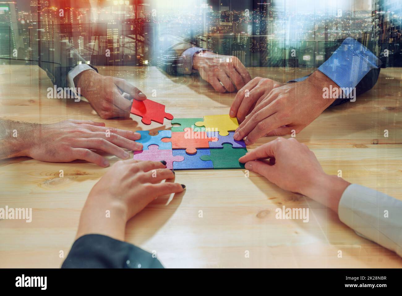Teamwork of partners connect puzzle pieces as integration and startup ...