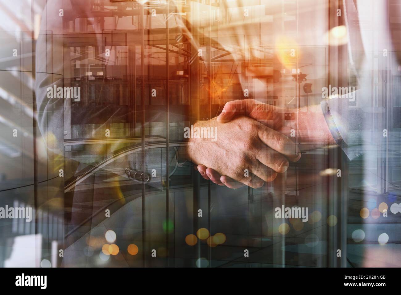 Handshaking of business person in office as teamwork and partnership ...