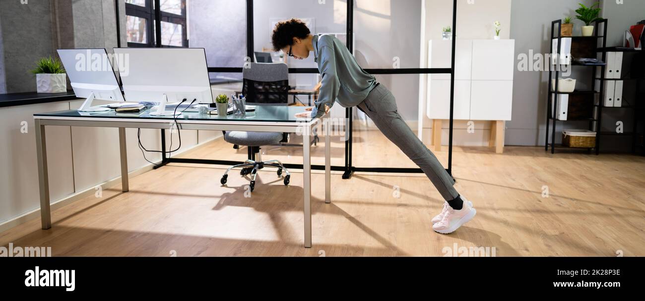 African American Doing Office Exercise Workout Stock Photo - Alamy