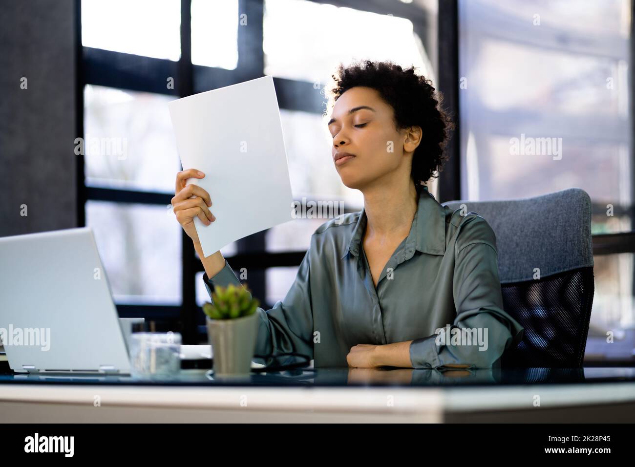Hot Office Weather. Woman Sweating Stock Photo - Alamy