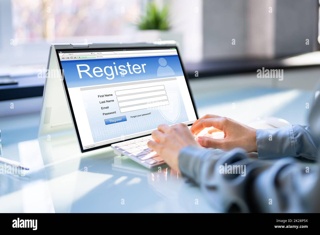 Businesswoman's Hand Filing Online Registration Form On Laptop Stock ...