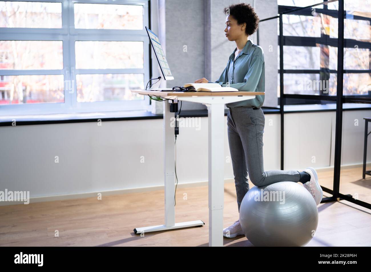 Adjustable Height Desk Stand In Office Stock Photo - Alamy