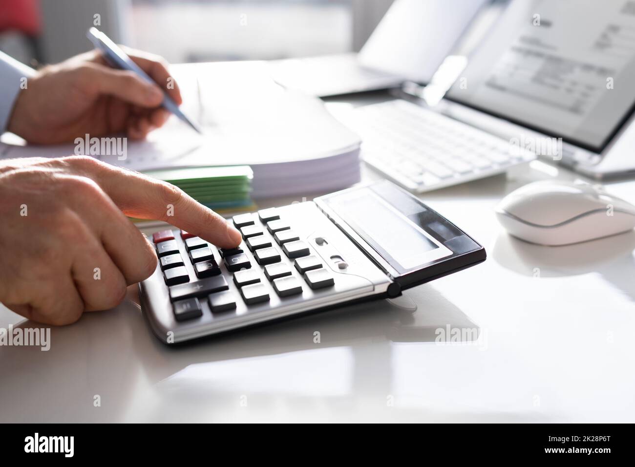 Accountant calculating finance calculator hi-res stock photography and ...