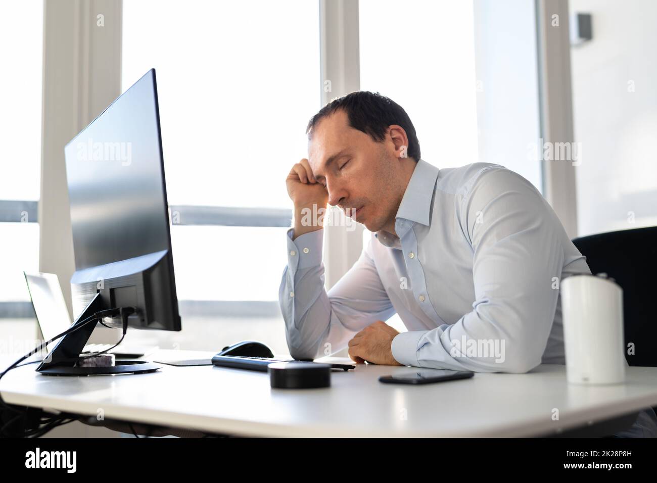 Bored Boss Man Sleeping Stock Photo - Alamy