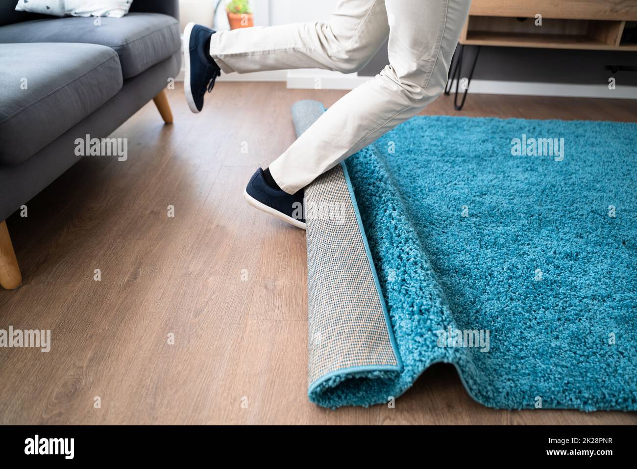 Man Carpet Stumble Accident And Falldown Stock Photo - Alamy