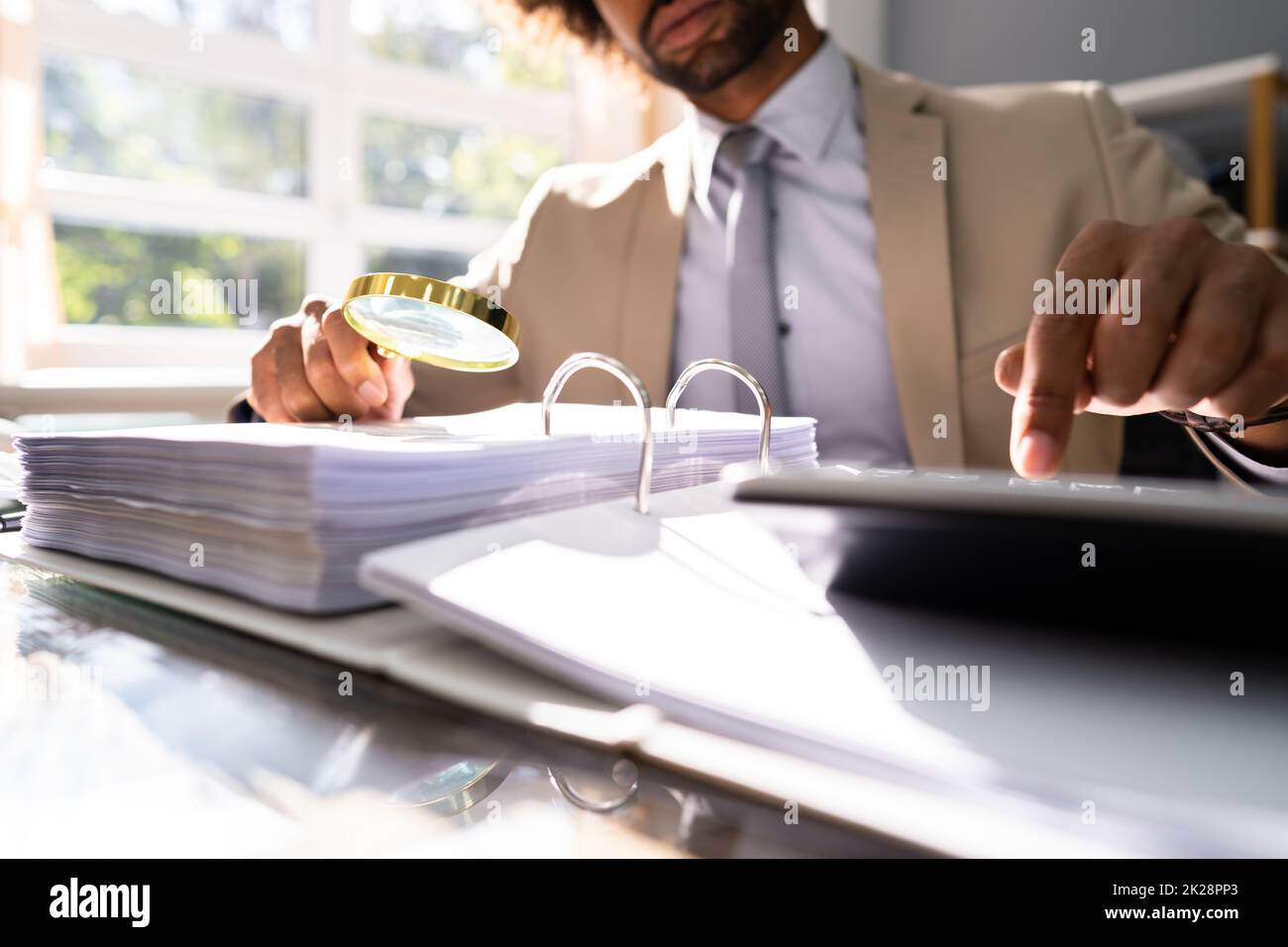 Lawyer Examining Paper Using Magnifier Glass Stock Photo - Alamy