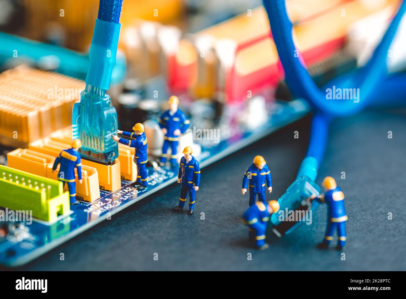 Repair workers working on a computer's motherboard Stock Photo - Alamy