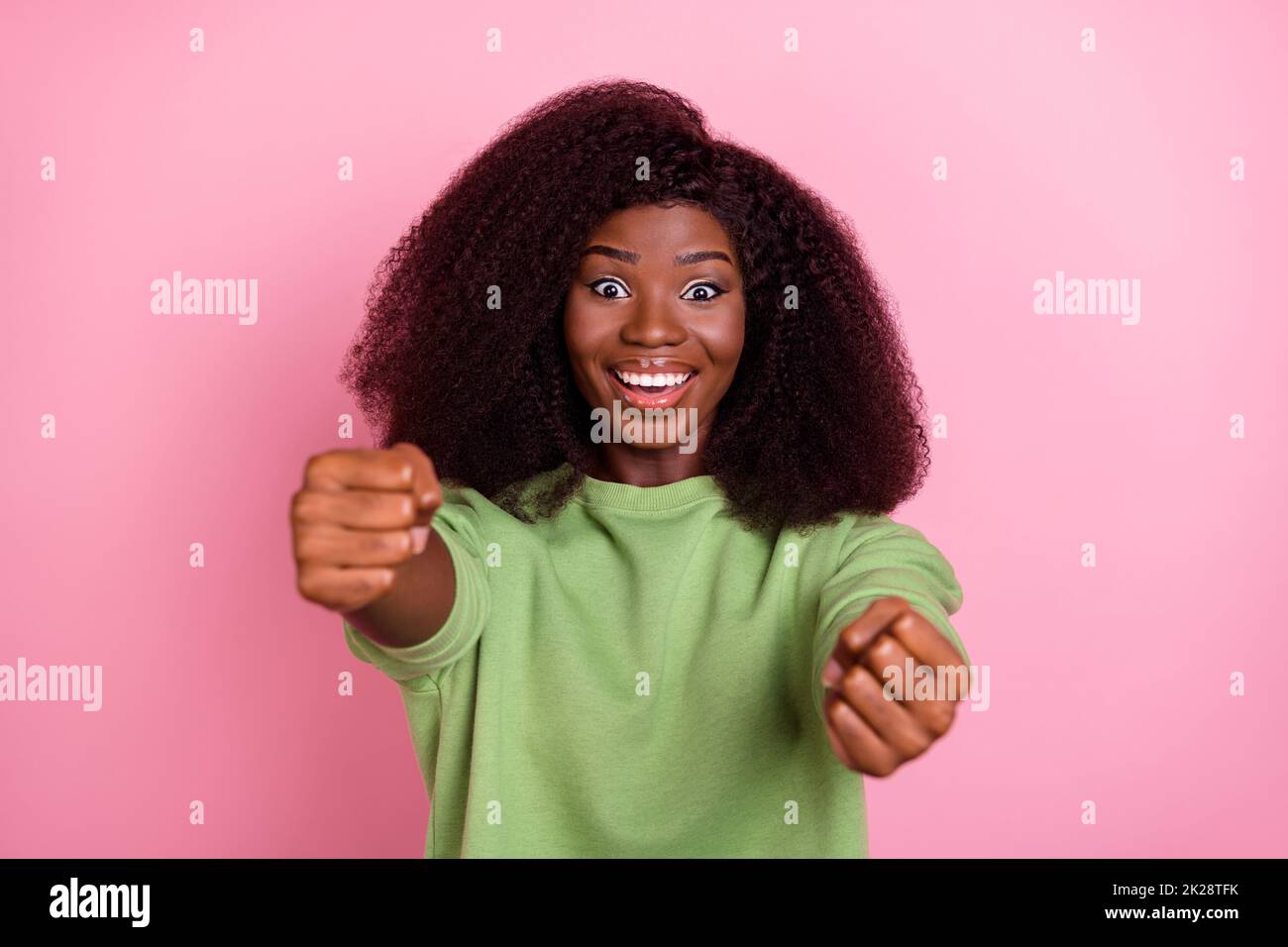 Photo of cheerful satisfied person arms hold imagine wheel toothy smile ...