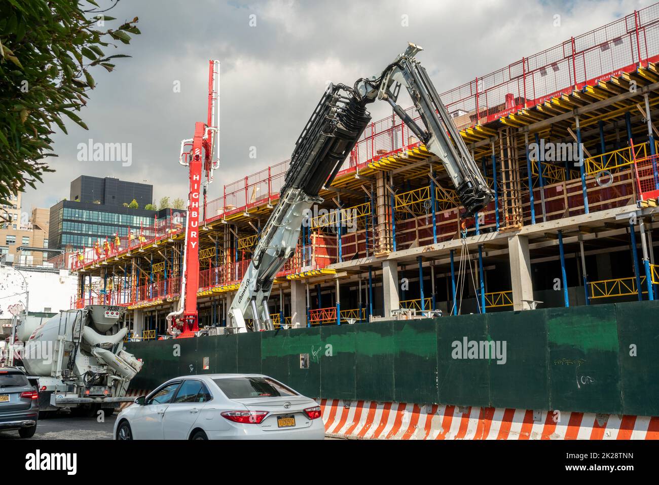 Concrete pumping and other activities at the construction of senior ...
