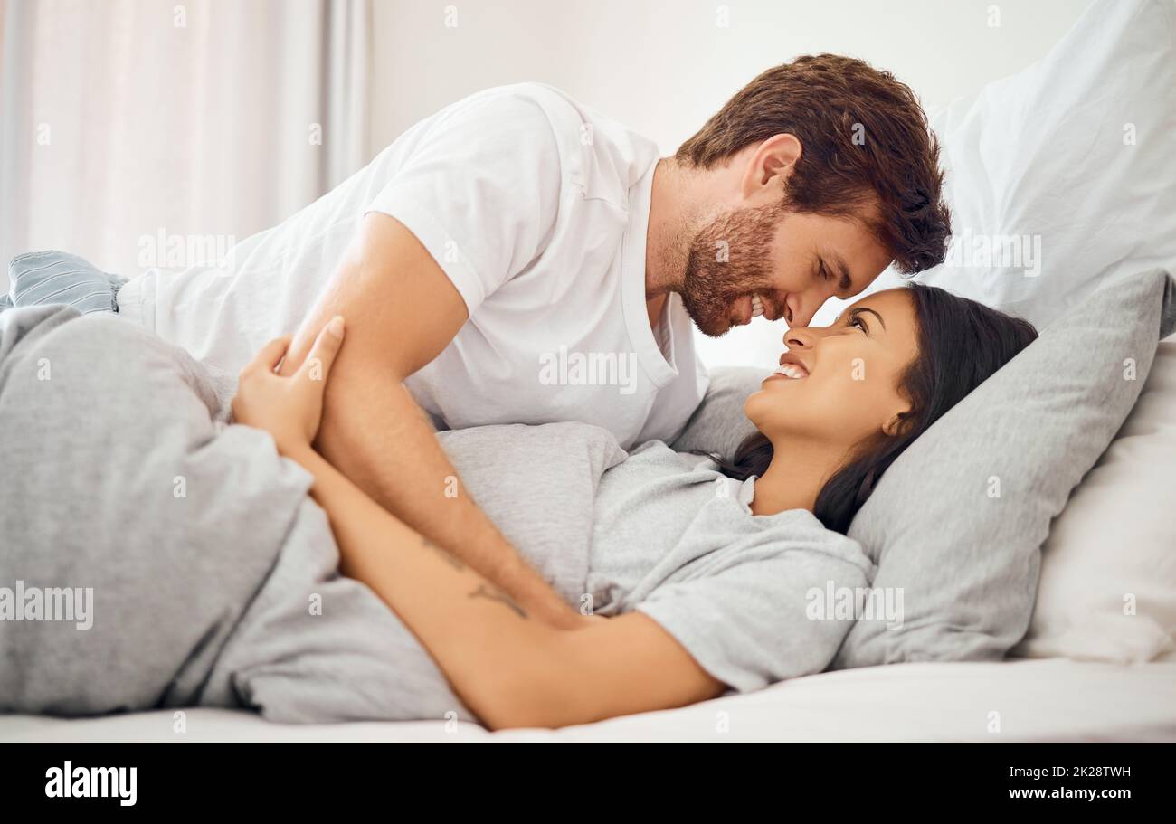 Love, morning and wake up with couple in bed together for care ...