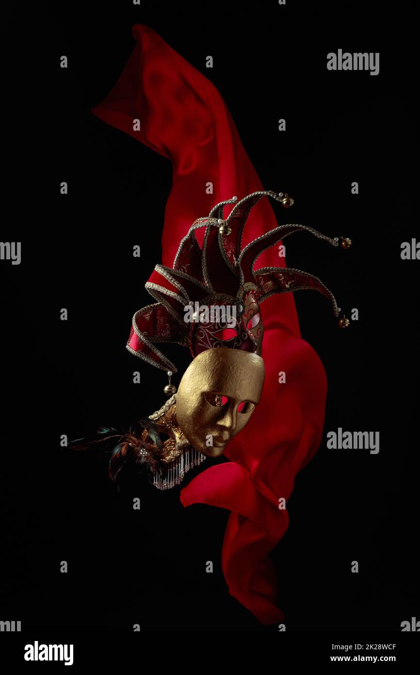 Old carnival masks on a black background with flutters red cloth Stock ...
