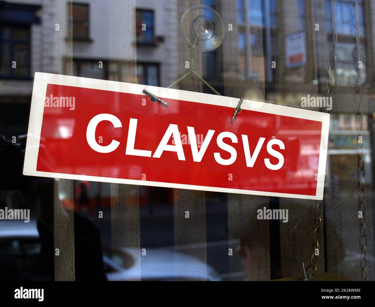 Closed sign in a shop window written in Latin Stock Photo - Alamy