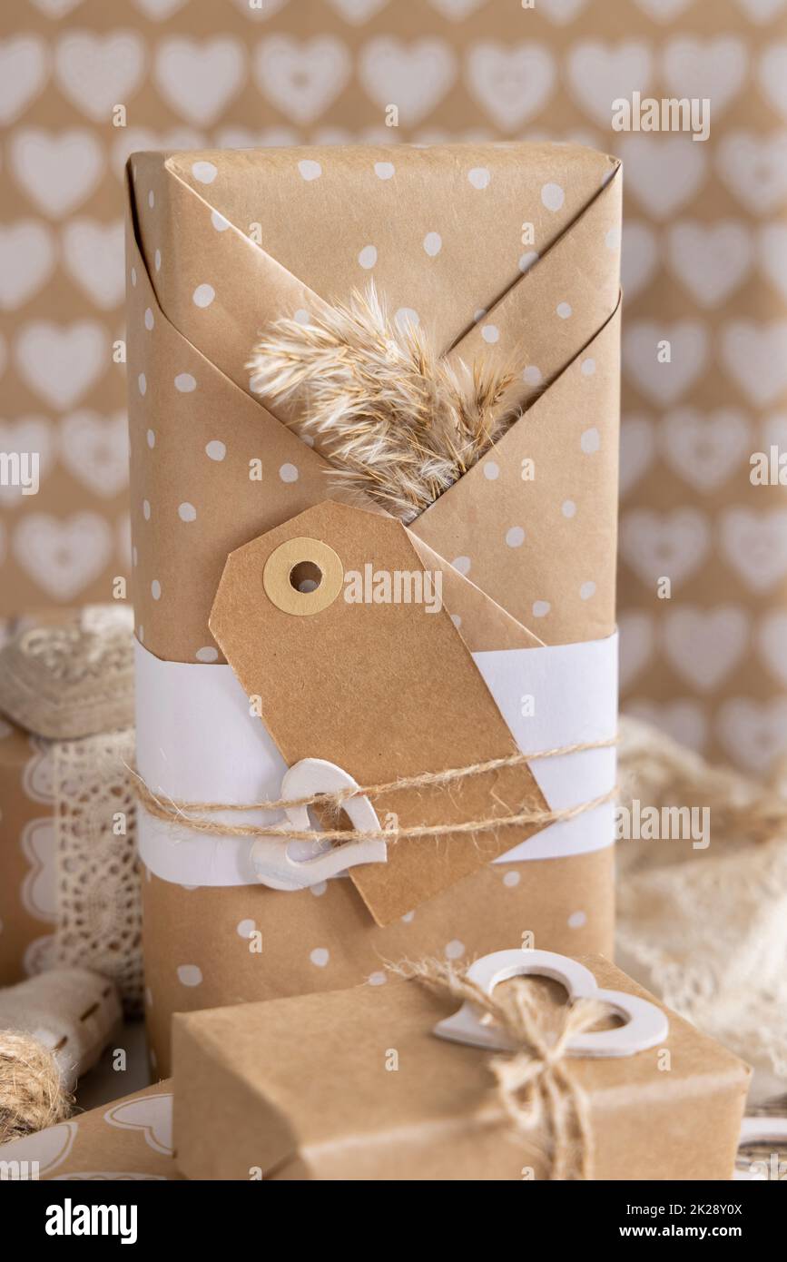 Valentines present with vertical blank gift tag and hearts close up ...