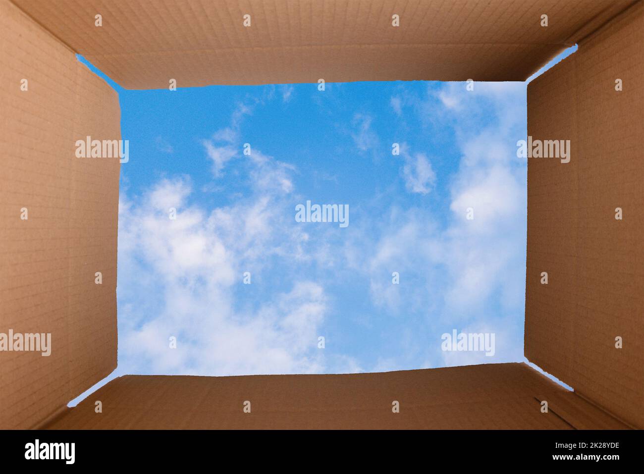 Think outside the box, open package against the blue sky, furistic ...