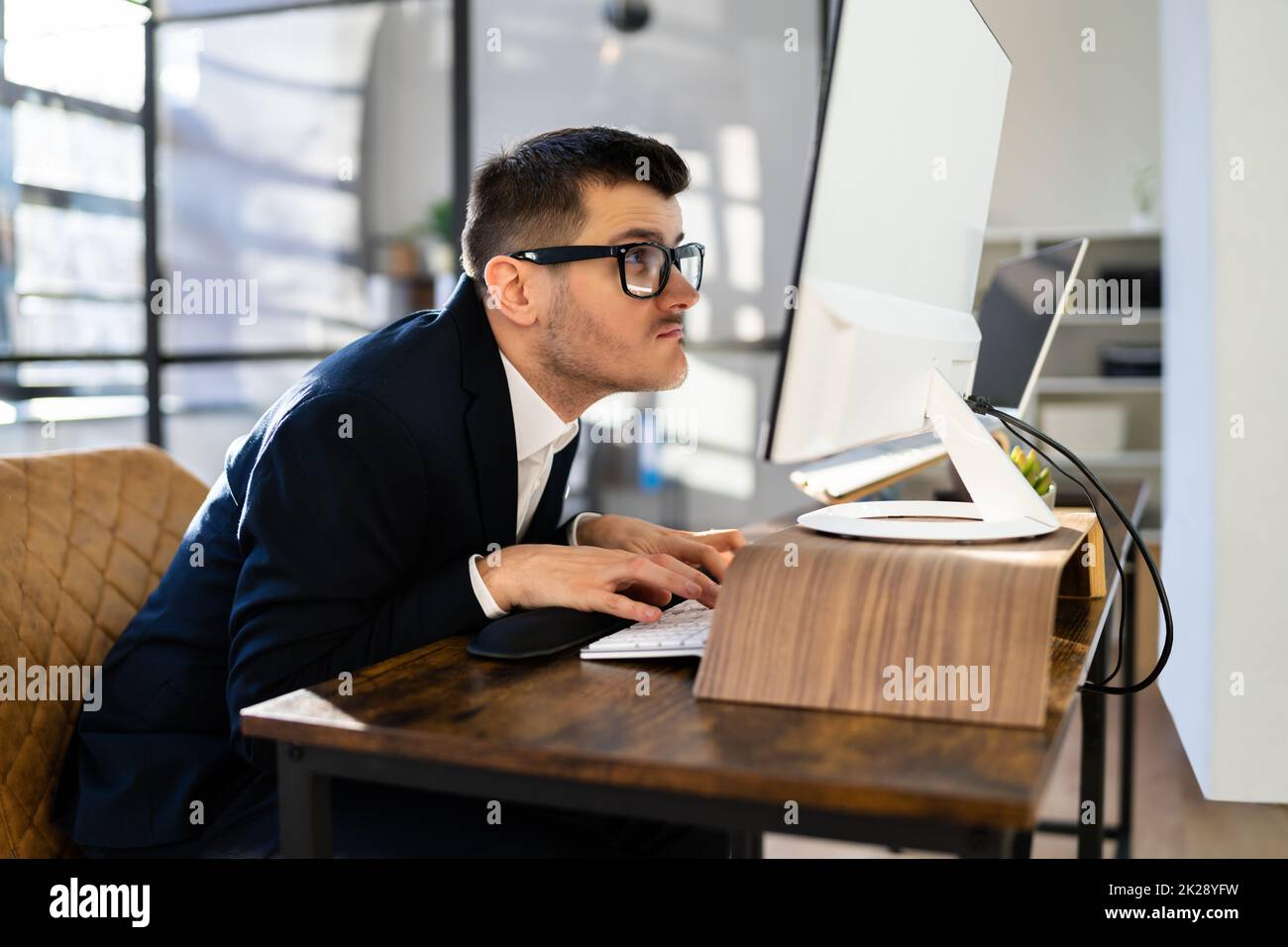 Sitting In Wrong Bad Posture Stock Photo - Alamy