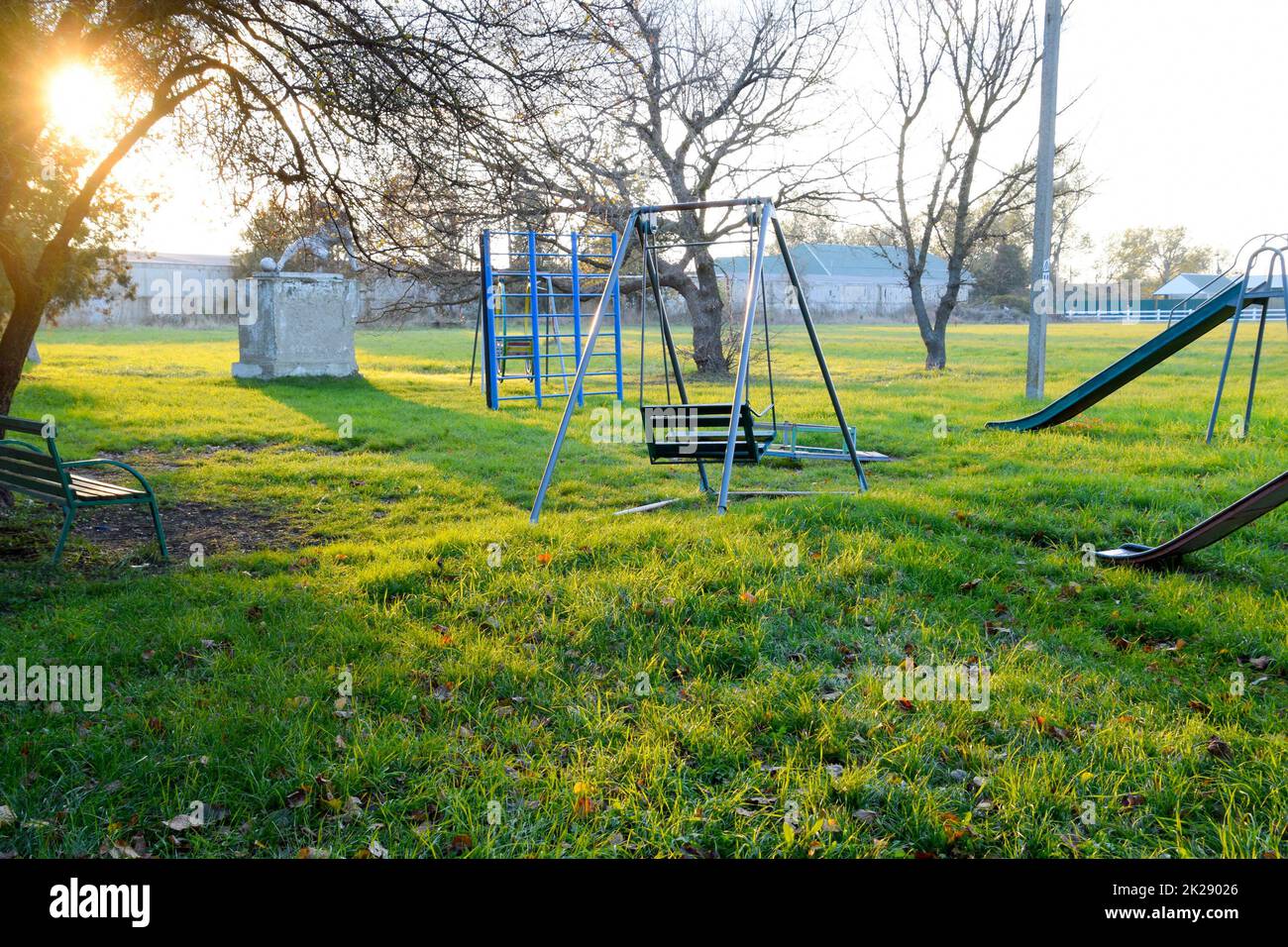 Children's playground near the stadium on the background of sunset ...