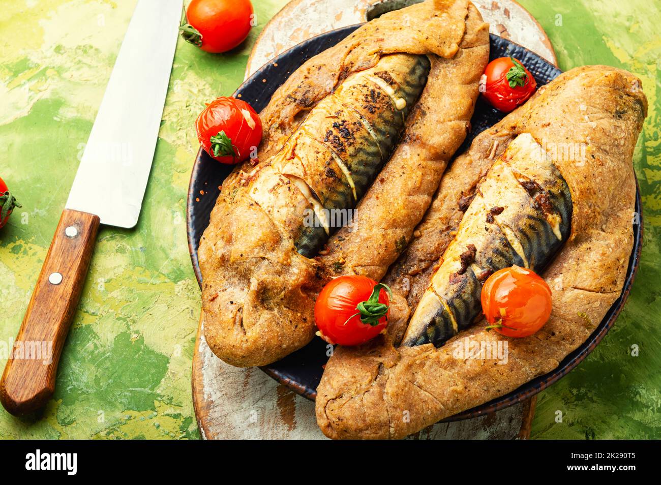 Mackerel baked in bread loaf Stock Photo - Alamy