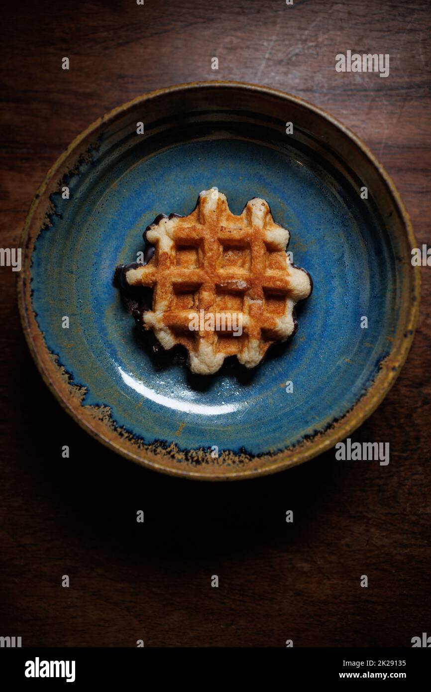 Waffle in handmade clay plate Stock Photo - Alamy