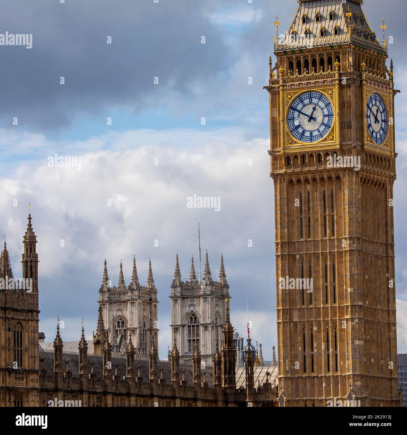 The magnificent Elizabeth Tower with the towers of Westminster Abbey in ...