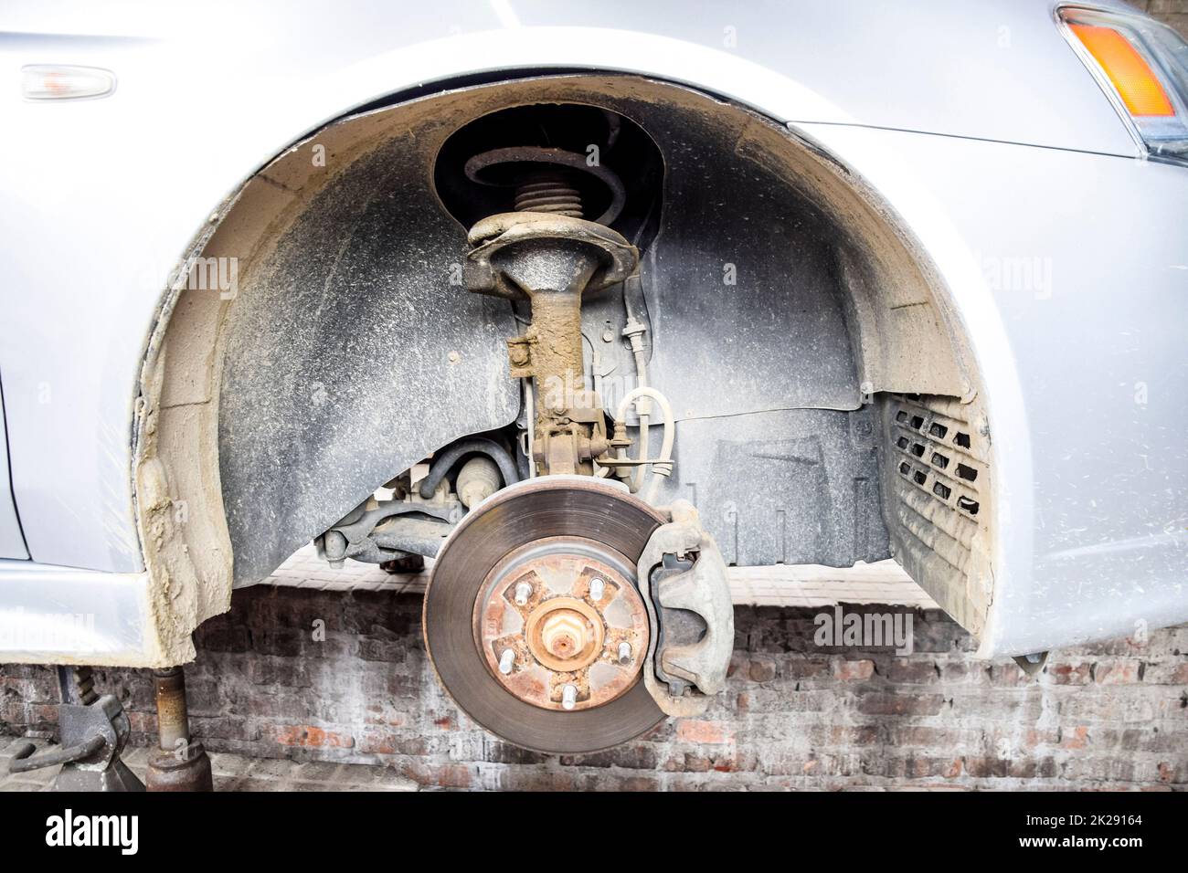 The car is a hundred for repairs. The wheel is removed. Replacement of ...