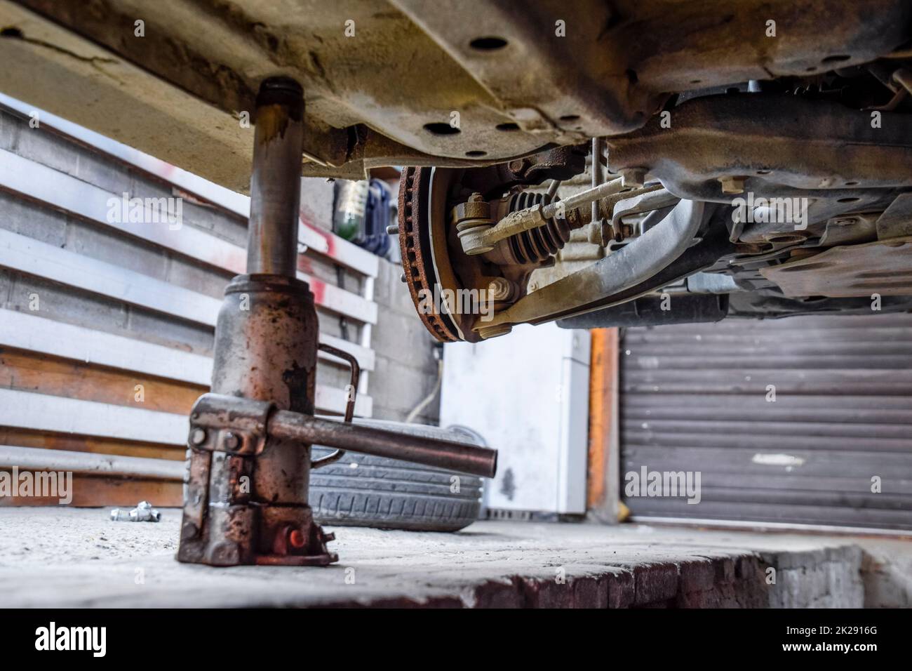Forged car for a hundred. Car repair. Car view from below Stock Photo ...