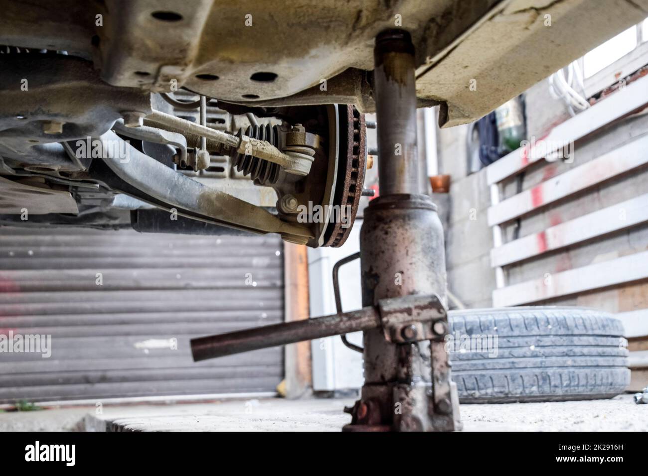 Forged car for a hundred. Car repair. Car view from below Stock Photo ...