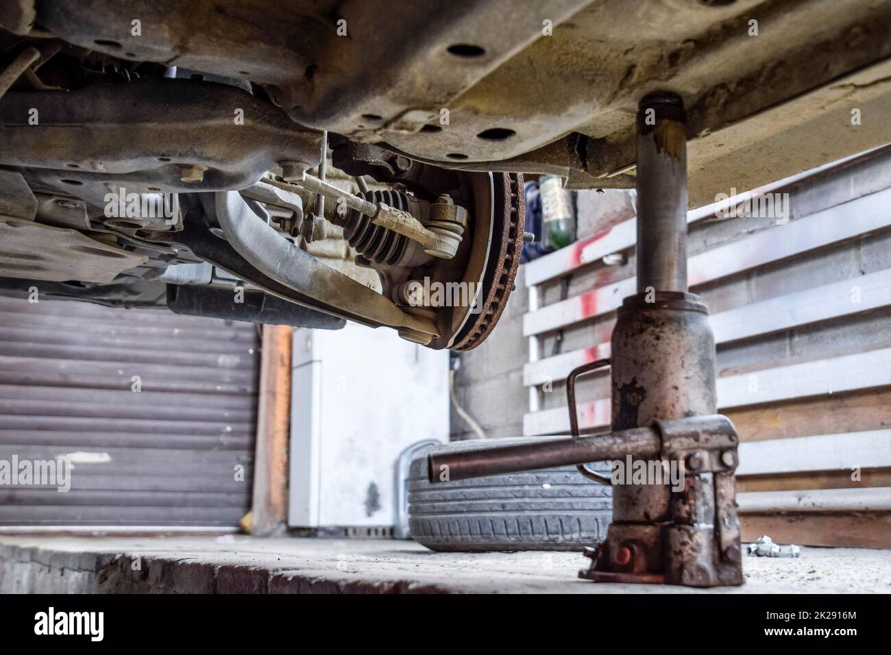 Forged car for a hundred. Car repair. Car view from below Stock Photo ...