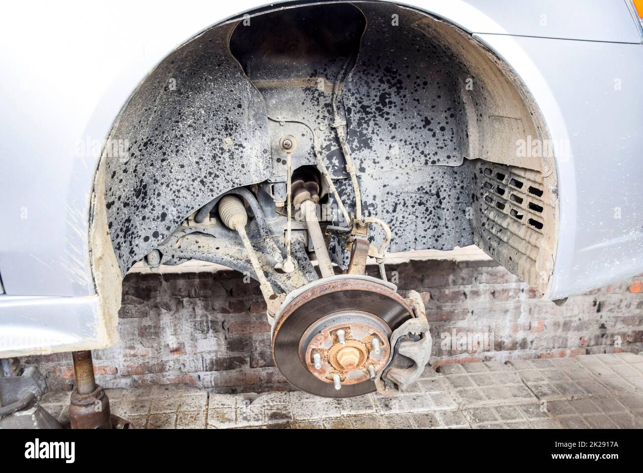 The car is a hundred for repairs. The wheel is removed. Replacement of ...