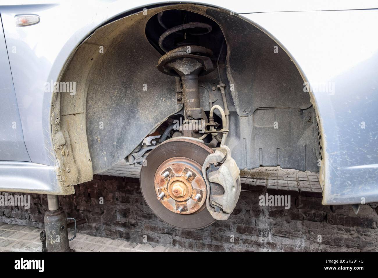 The car is a hundred for repairs. The wheel is removed. Replacement of ...