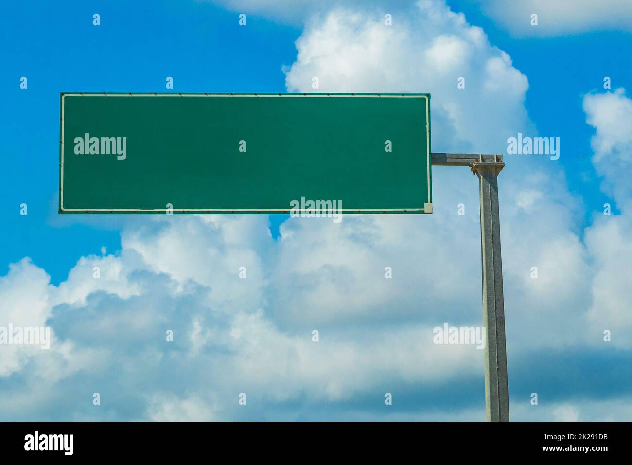 Directional green blank empty road sign in Tulum Mexico Stock Photo - Alamy