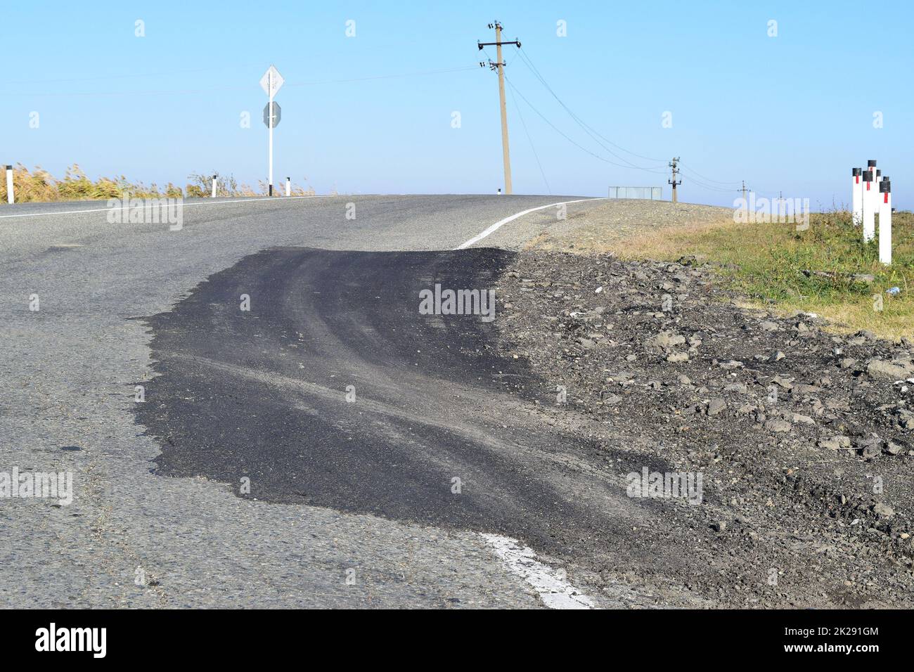 Repair of an asphalt road surfacing Stock Photo - Alamy