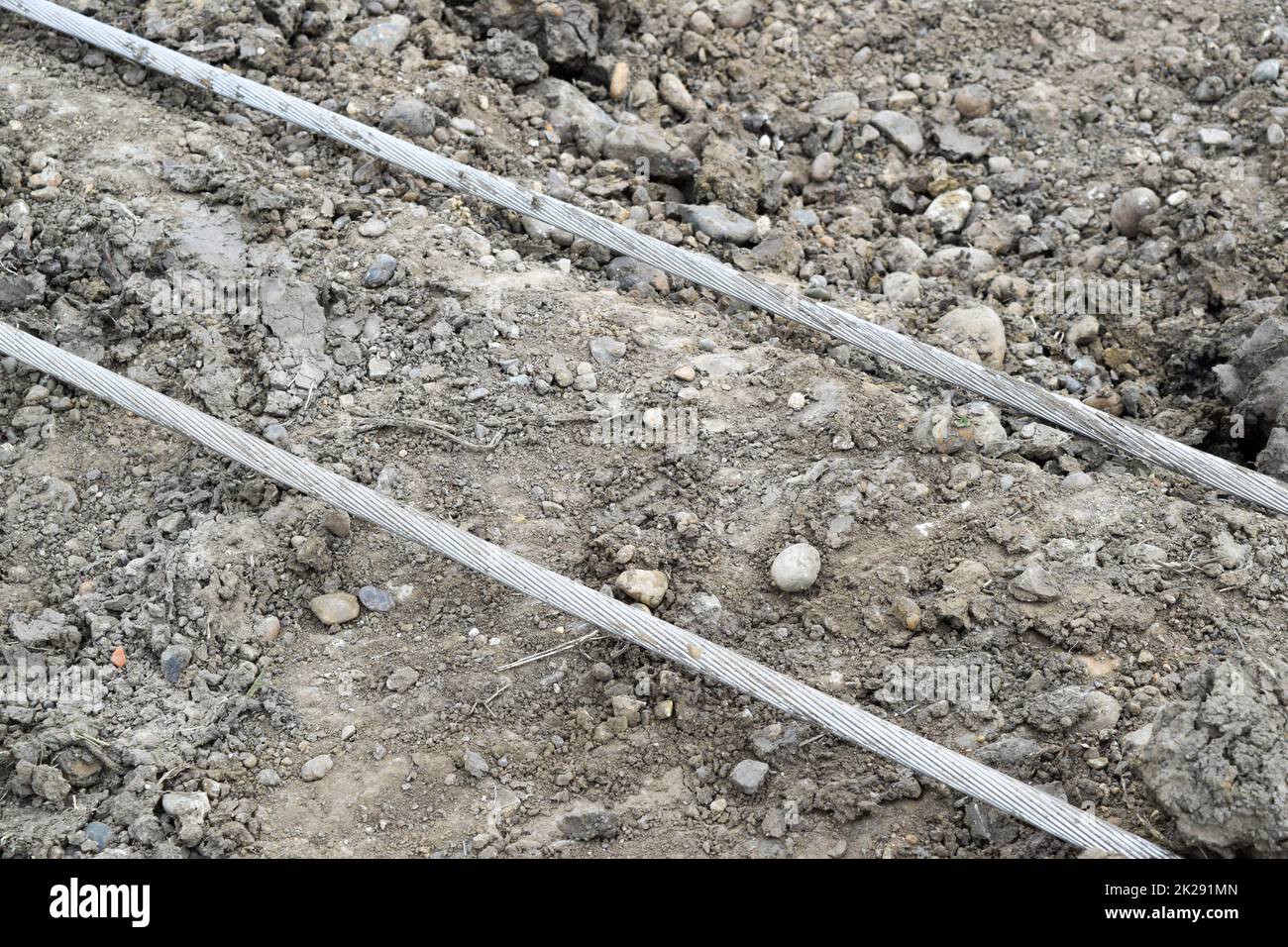 High aluminum wires on the ground. Installation of high-voltage power ...