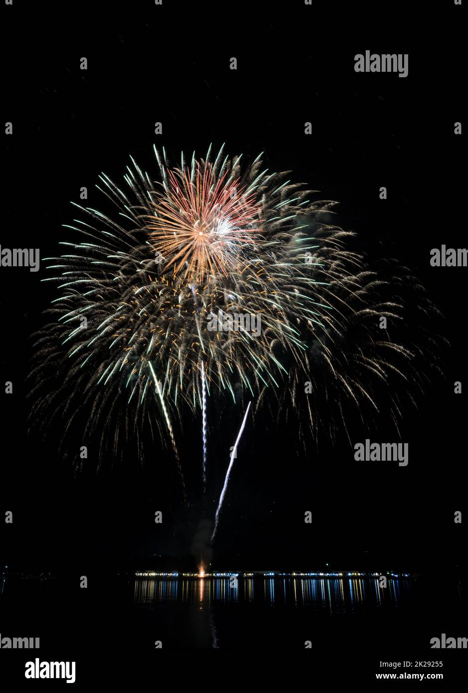 Colorful fireworks with reflection on lake Stock Photo - Alamy