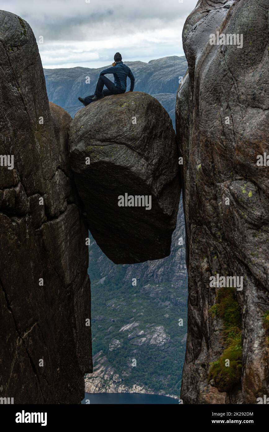 Visiting Norway Kjeragbolten located south of Lysefjorden Stock Photo ...