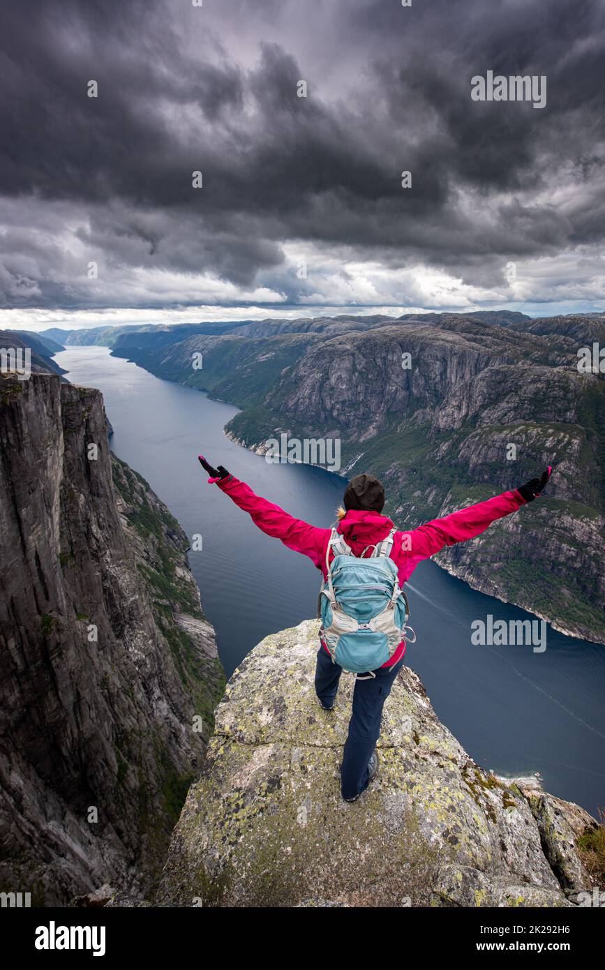 Eagle head viewpoint near Kjeragbolten Lysebotn Norway Young Woman in ...