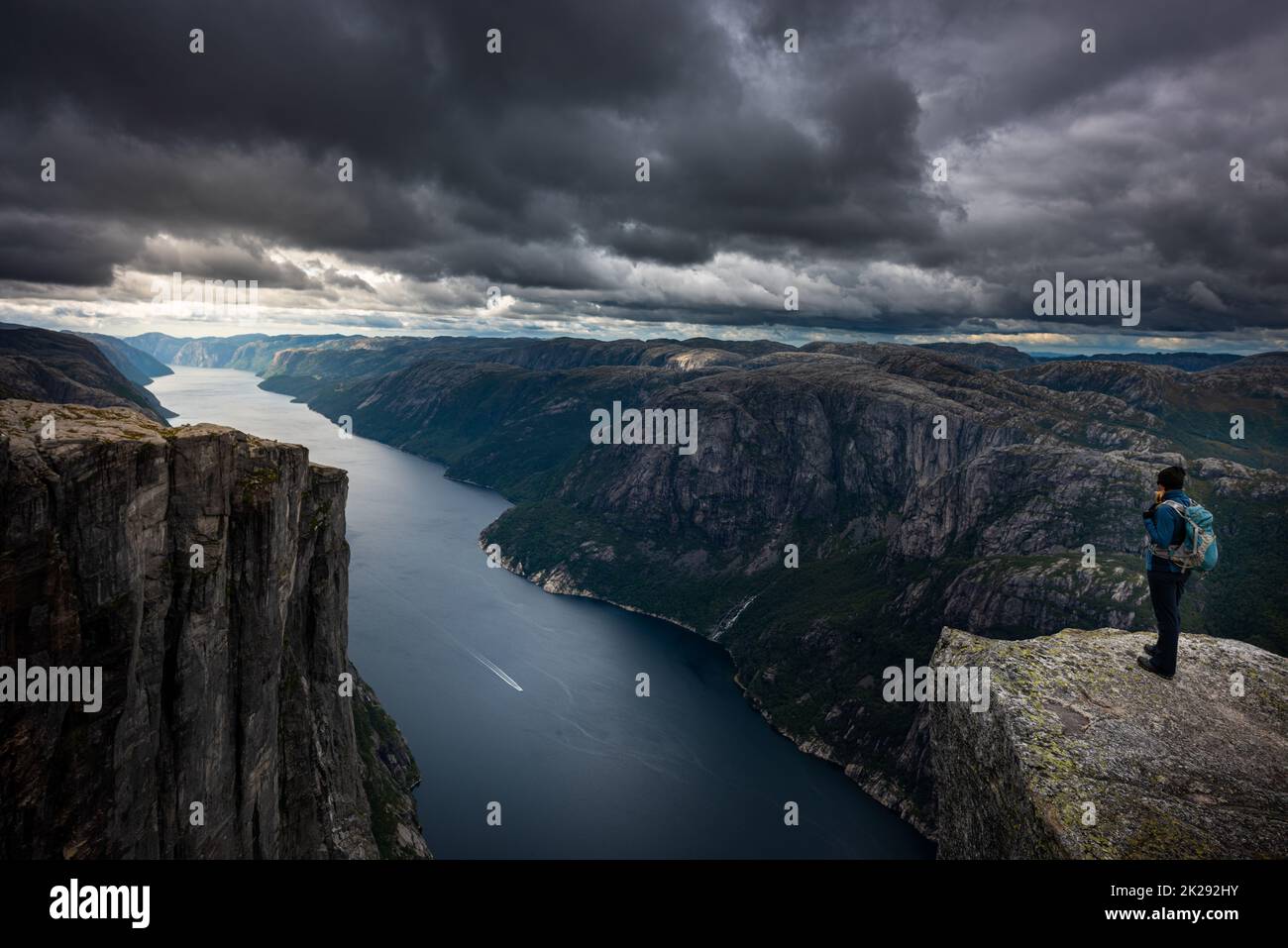 Eagle head viewpoint near Kjeragbolten Lysebotn Norway Woman stands by ...