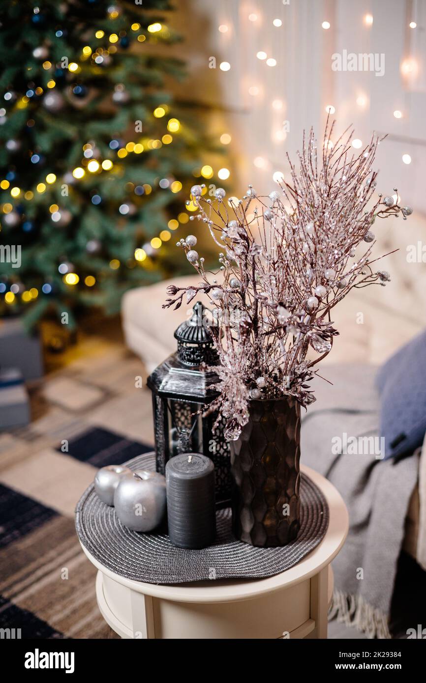 Decorative antique silver retro lamp on a white small table in the ...